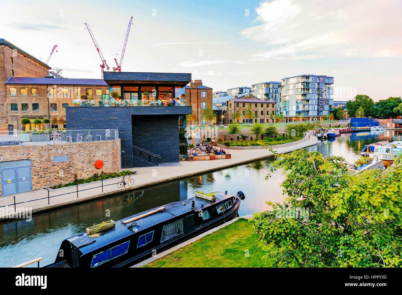 Kings cross canal with buildings and boats in the evening Stock Photo ...