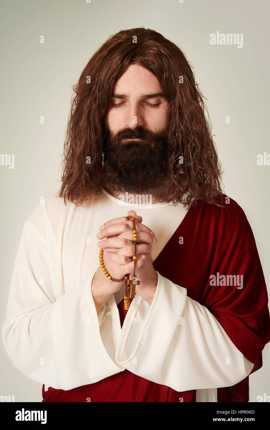 Studio shot of Jesus with rosary Stock Photo - Alamy