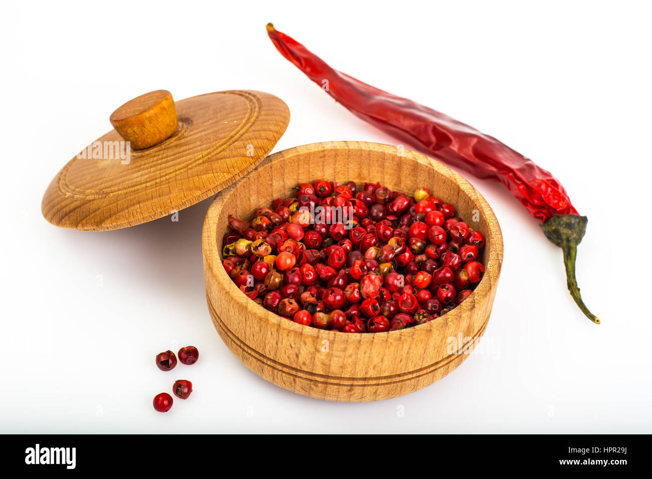 Spicy Spice Pink pepper peas on white background. Studio photo Stock ...