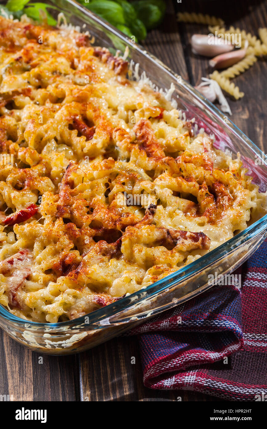Casserole fusilli pasta with sausage, zucchini, paprika and cheese ...