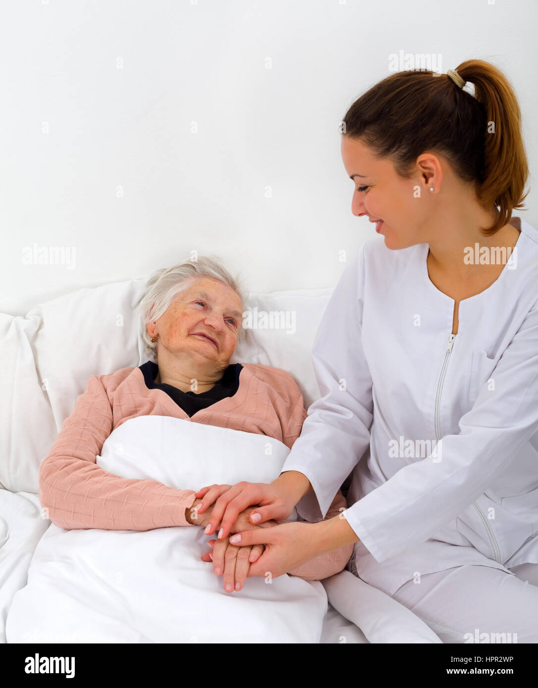 Elderly woman with her caregiver at home Stock Photo - Alamy