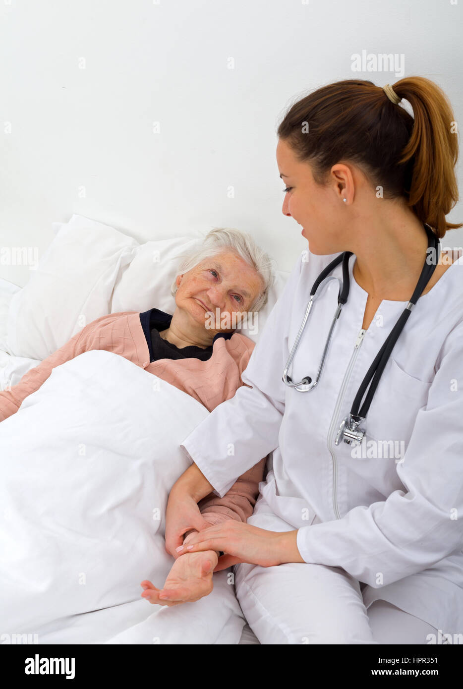 Elderly woman with her caregiver at home Stock Photo - Alamy