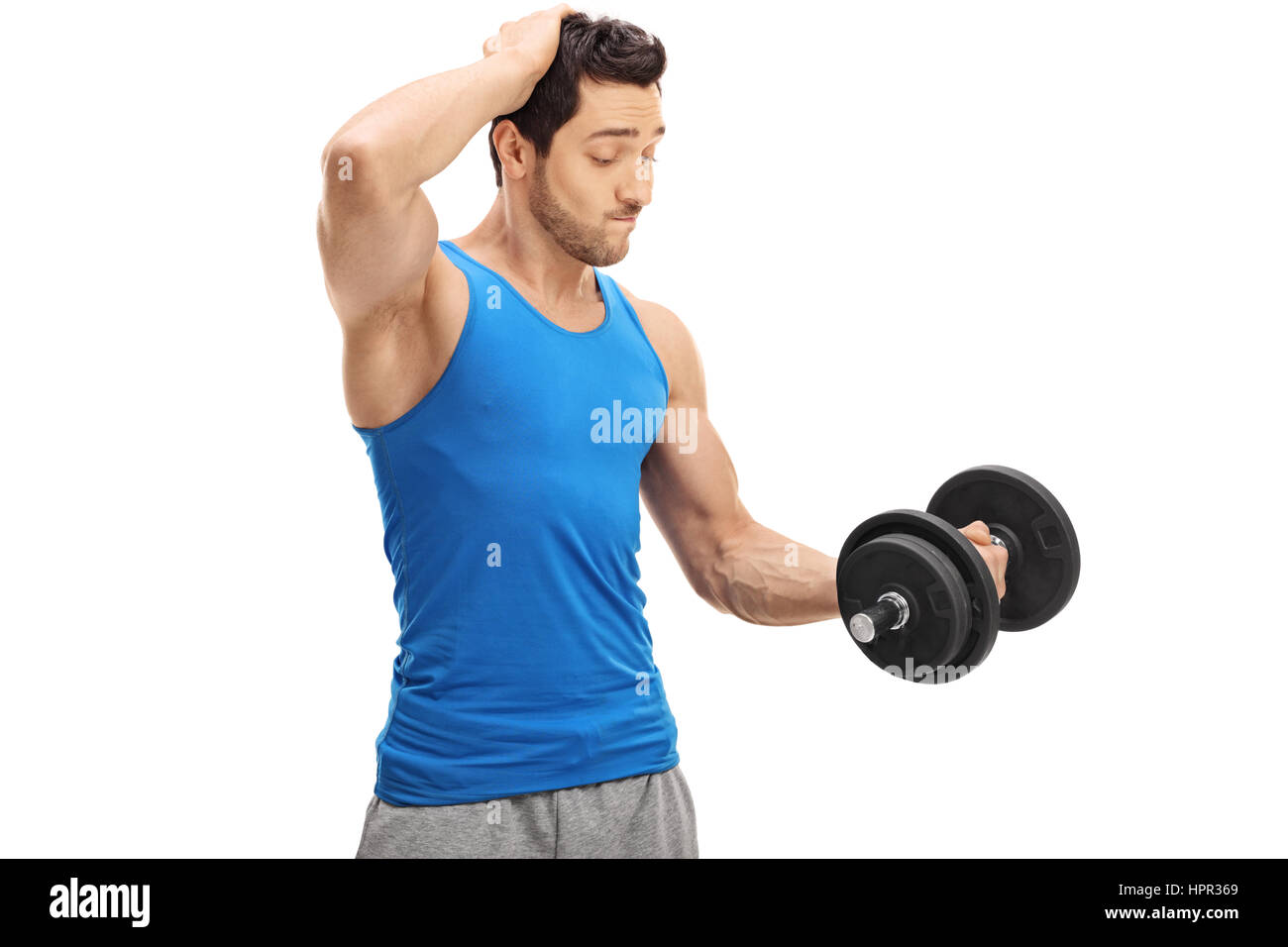 Exhausted man lifting a dumbbell isolated on white background Stock ...