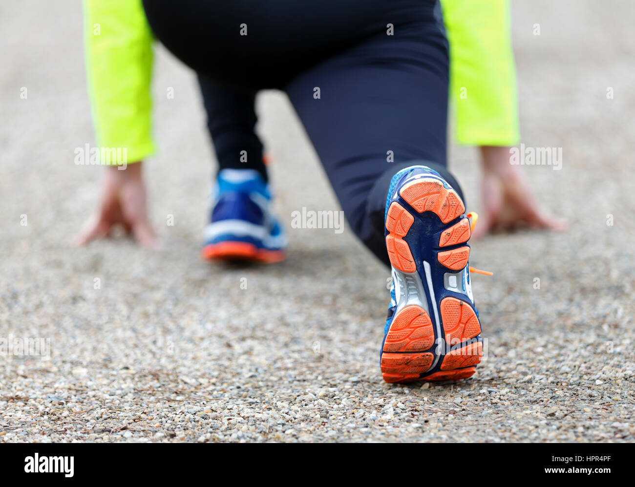A professional runner preparing for the start on the start line Stock ...