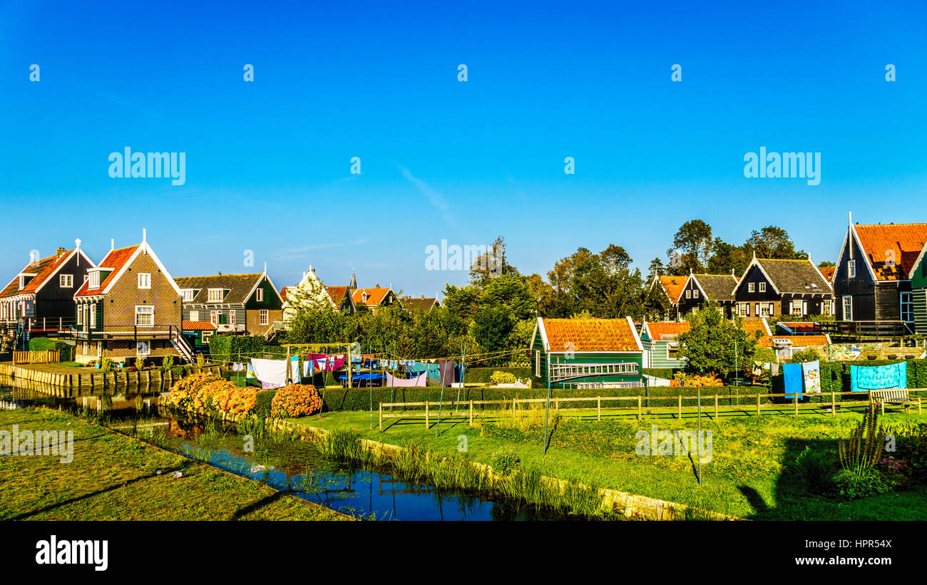 Typical traditional houses with green wall and red tiled roof in the ...