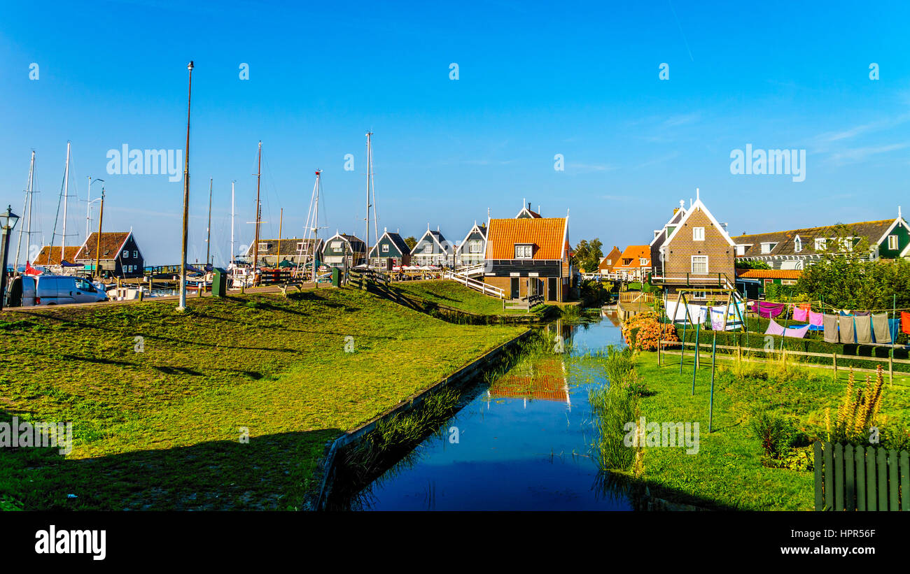 Typical traditional houses with green wall and red tiled roof in the ...