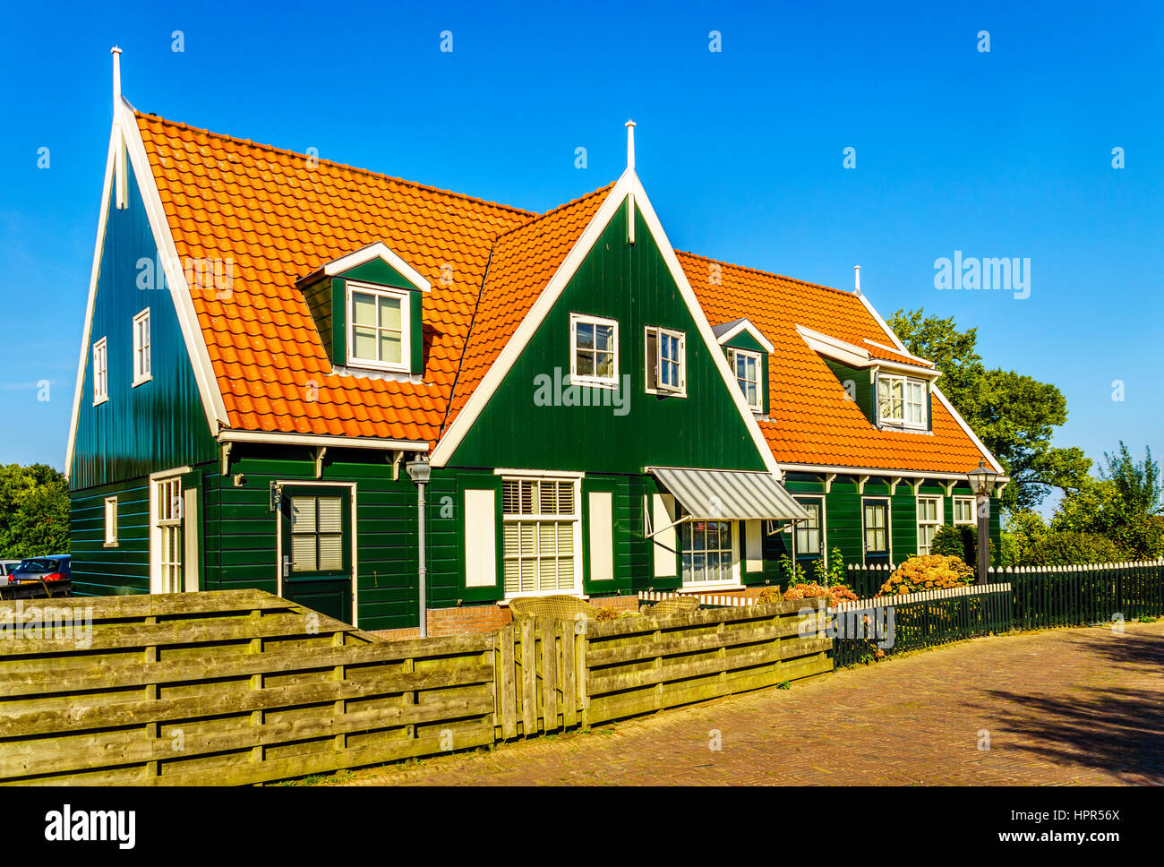 Brick house picket fence hi-res stock photography and images - Alamy