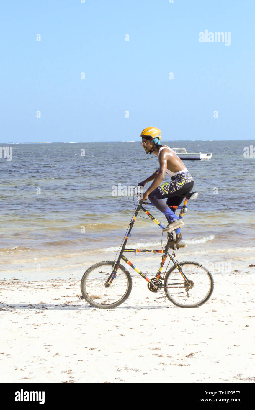 Acrobat with a double bike on the beach of Bamburi in Kenya Stock Photo ...