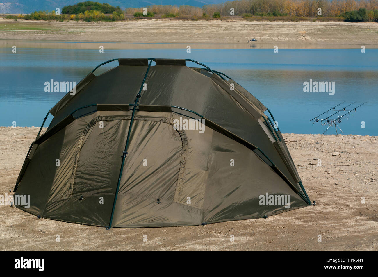 Landscape with fishing rods and hiking tent. Equipment for carp fishing ...
