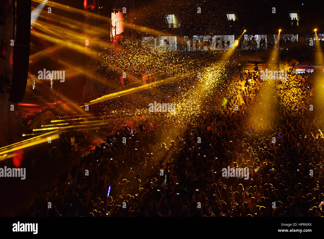CLUJ-NAPOCA, ROMANIA - AUGUST 7, 2016: Confetti cannons throwing confetti from the stage over ...