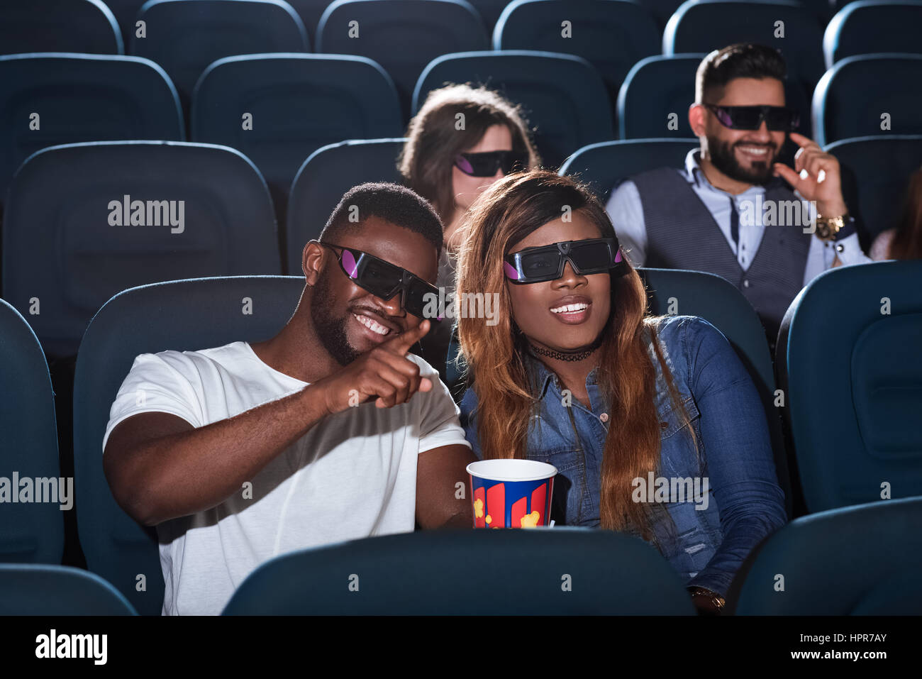 Attention on screen. Handsome African man pointing something out on a ...