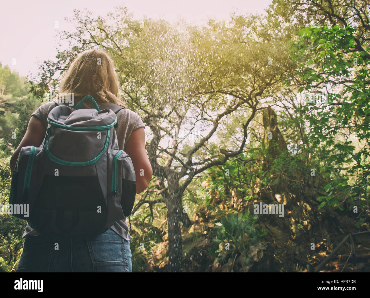 Woman with backpack enjoying nature. Back view Stock Photo - Alamy