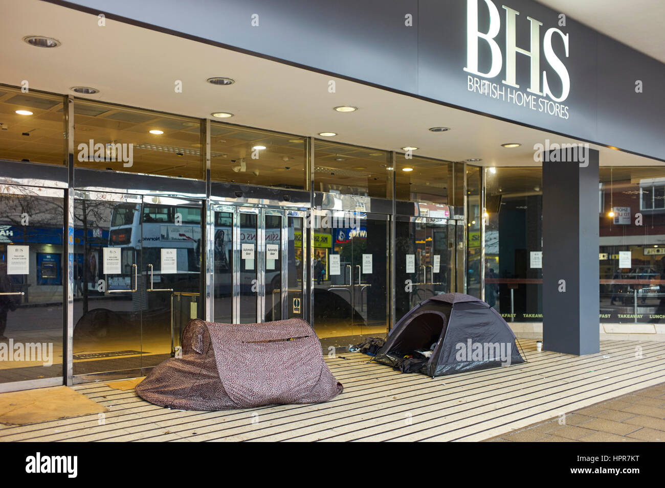 Homeless people and their tents in old British Home Stores doorway ...