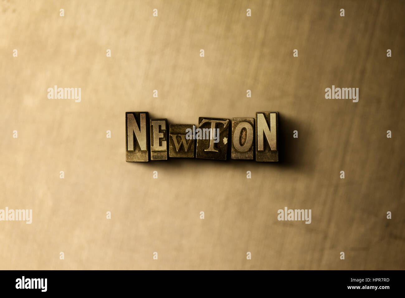 NEWTON - close-up of grungy vintage typeset word on metal backdrop ...