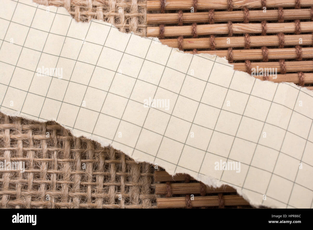 Piece of torn paper placed on a linen canvas Stock Photo - Alamy