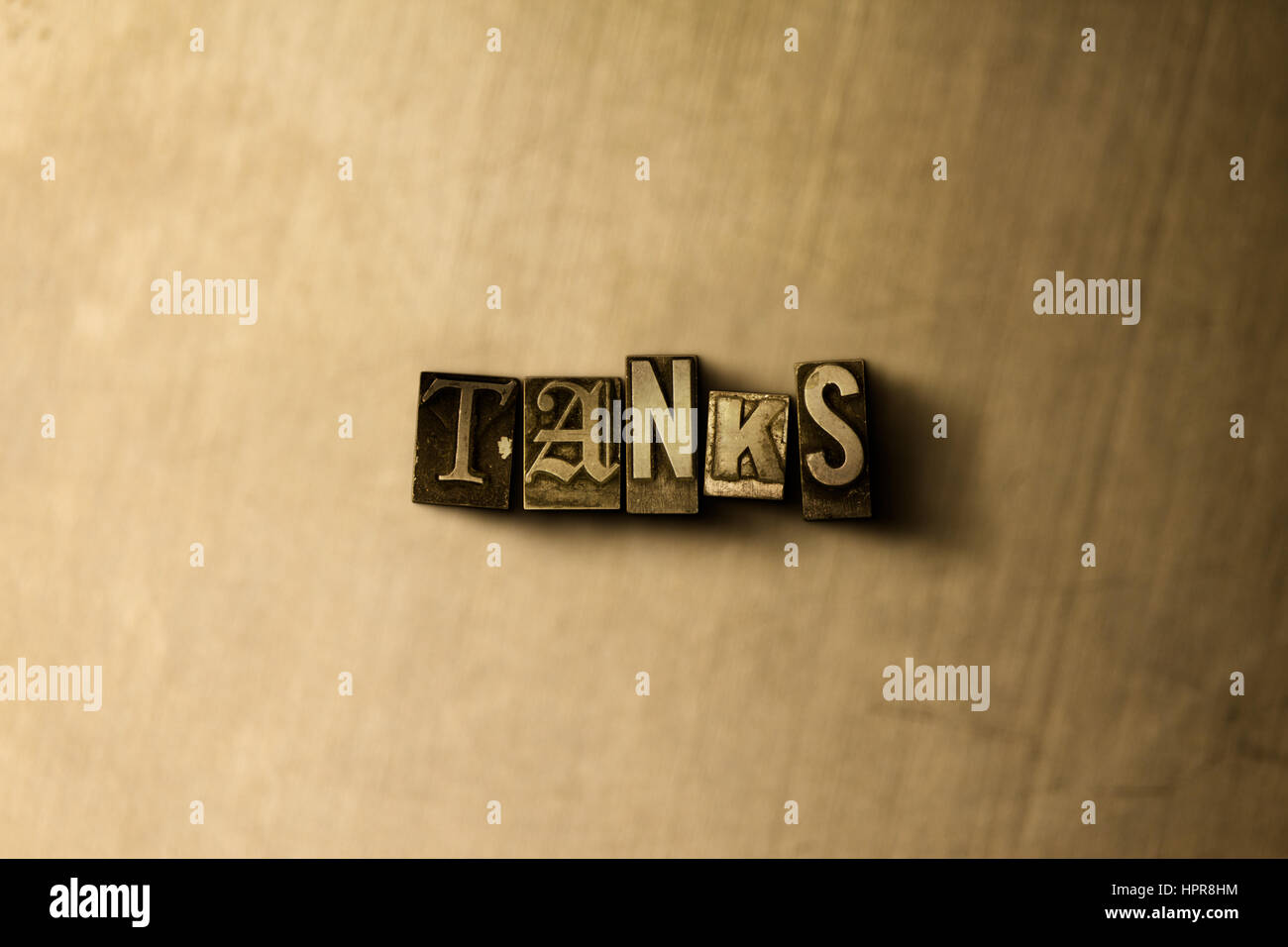 TANKS - close-up of grungy vintage typeset word on metal backdrop ...