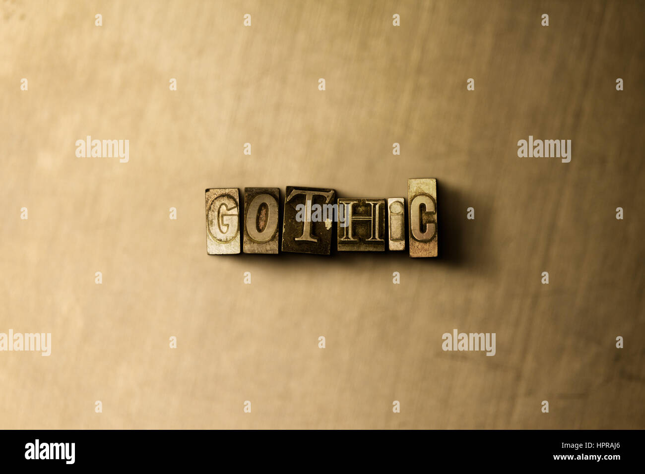 GOTHIC - close-up of grungy vintage typeset word on metal backdrop ...