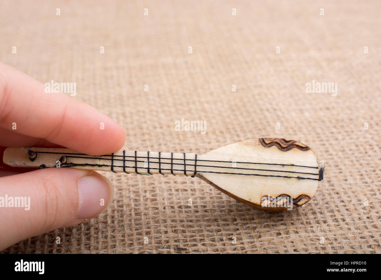Model of Turkish musical instrument saz on a linen canvas Stock Photo ...