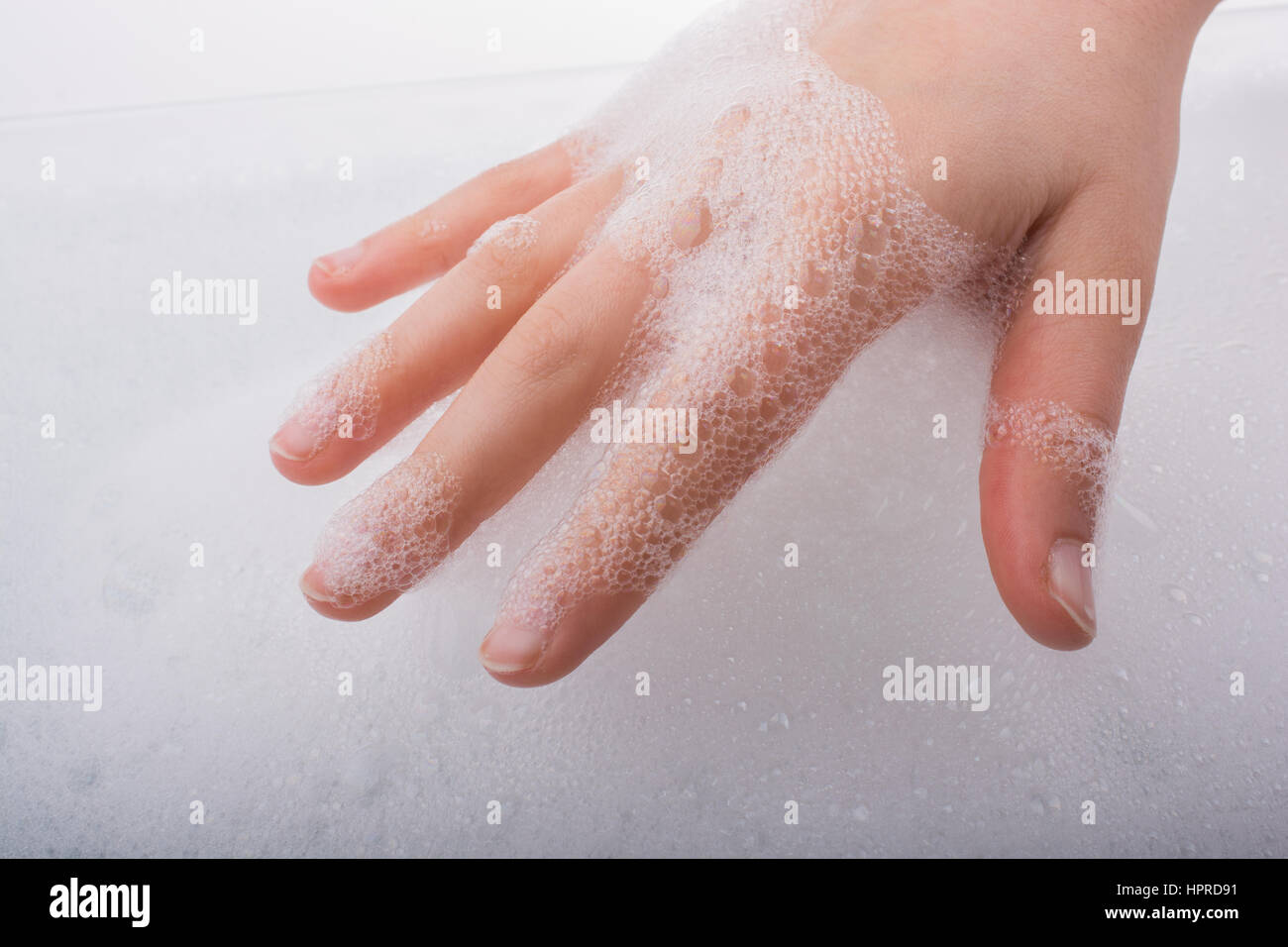 Hand washing and soap foam on a foamy background Stock Photo - Alamy