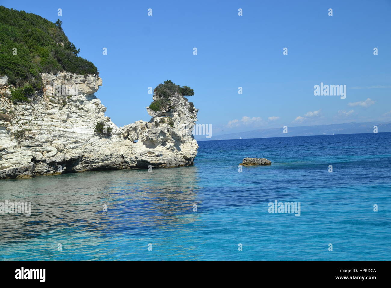 Rocks in Ionian sea at Corfu island in Greece Stock Photo - Alamy
