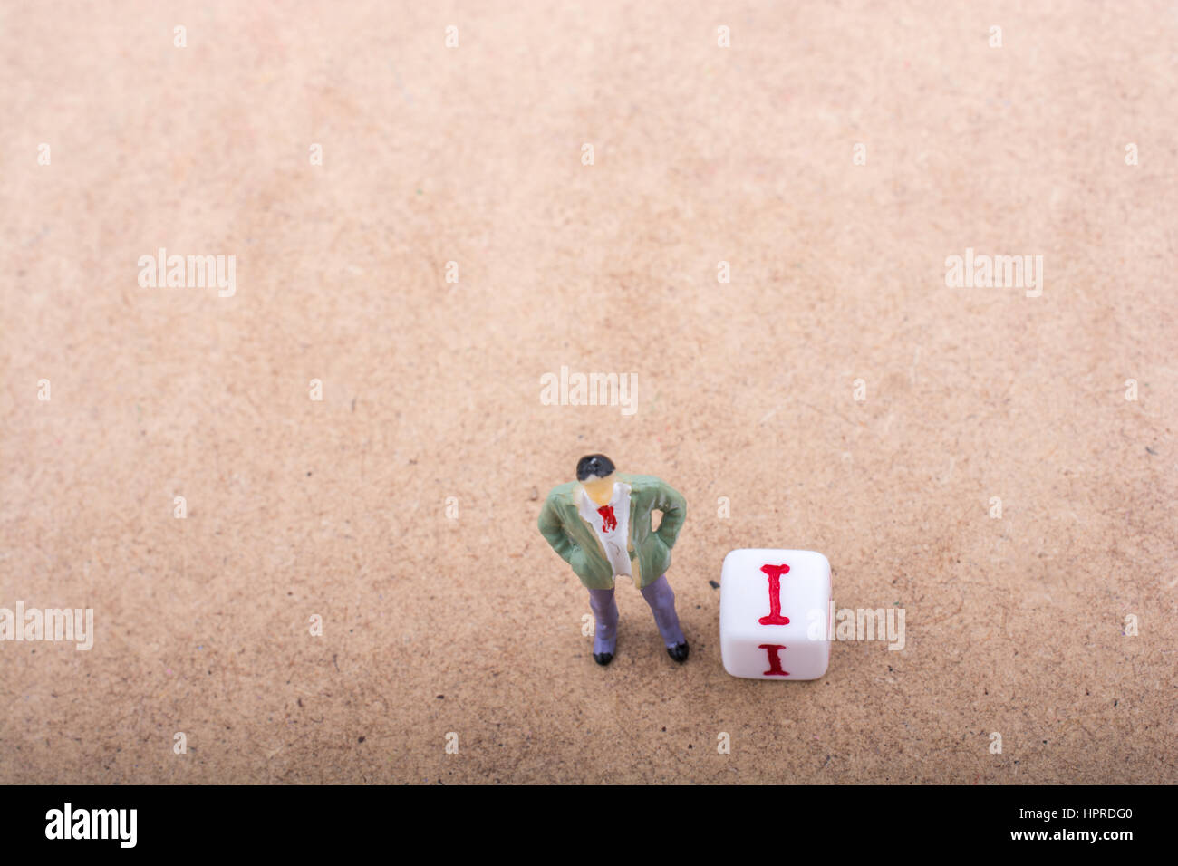 Figurine and the colorful alphabet letter cube I Stock Photo - Alamy