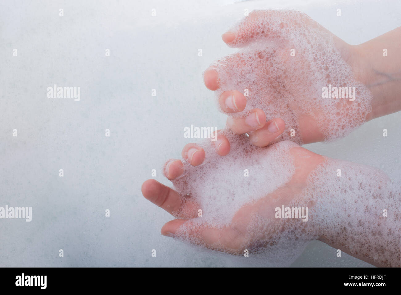 Hand washing and soap foam on a foamy background Stock Photo - Alamy