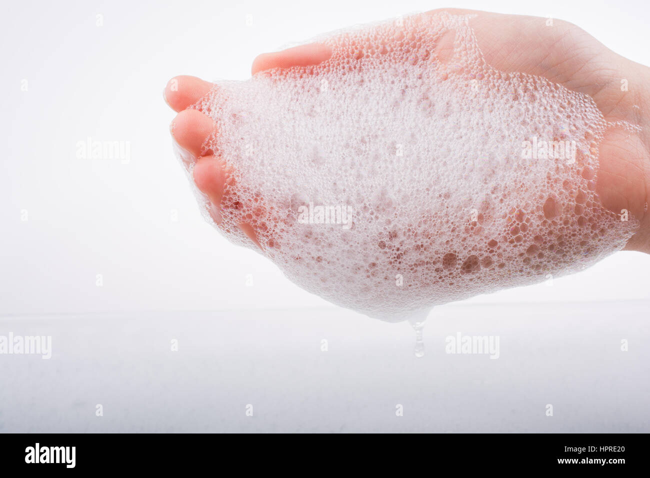 Hand washing and soap foam on a foamy background Stock Photo - Alamy