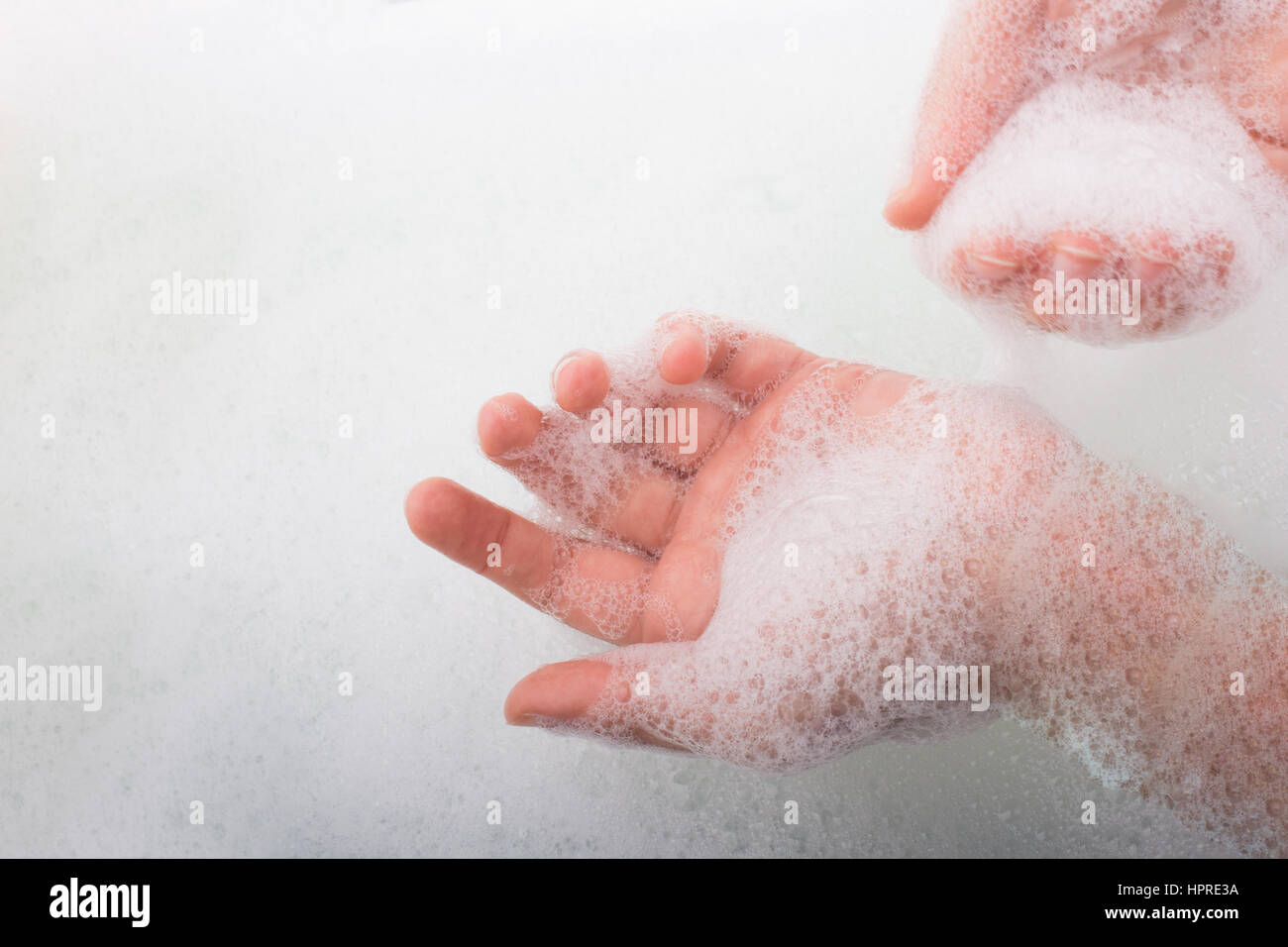 Hand washing and soap foam on a foamy background Stock Photo - Alamy