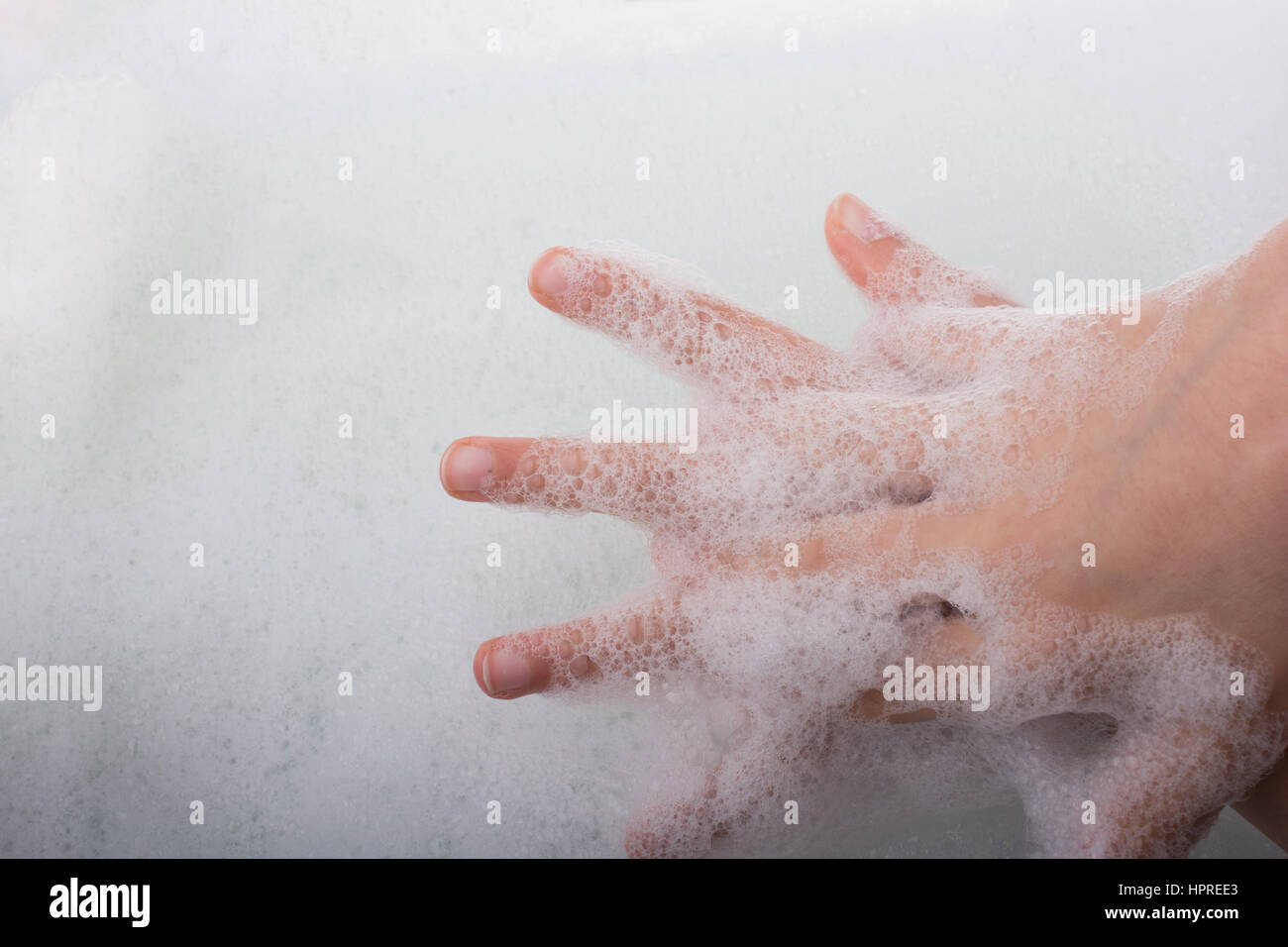 Hand washing and soap foam on a foamy background Stock Photo - Alamy