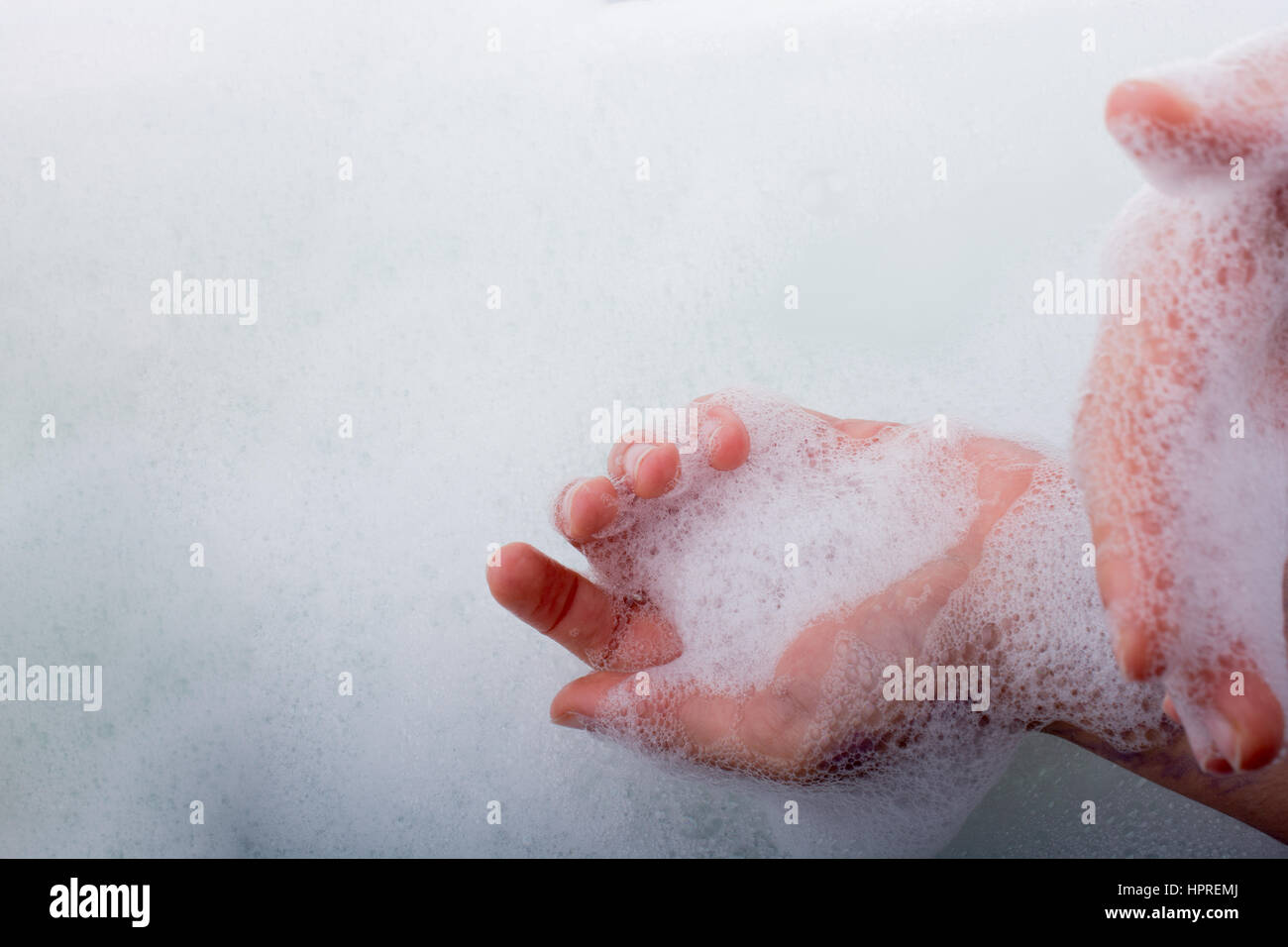 Hand washing and soap foam on a foamy background Stock Photo - Alamy