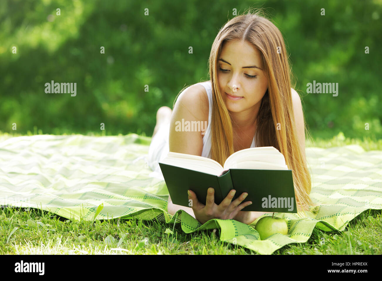 Beautiful blonde woman reading book hi-res stock photography and images ...