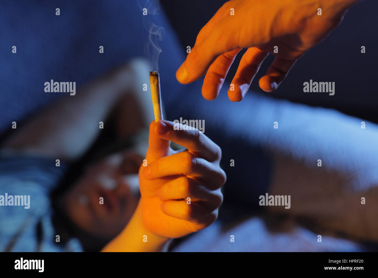 Teenager holding marijuana joint hi-res stock photography and images ...