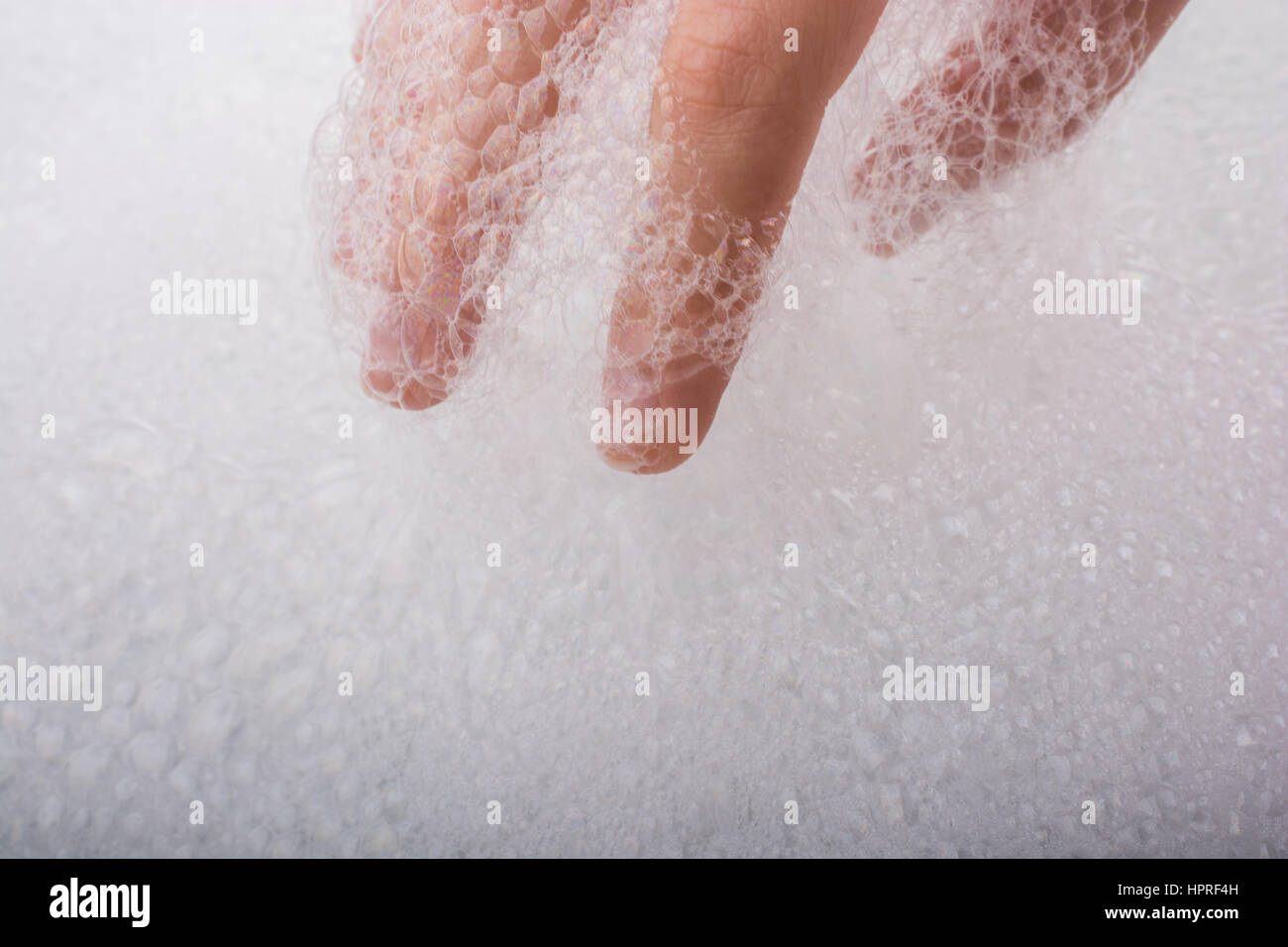 Hand washing and soap foam on a foamy background Stock Photo - Alamy
