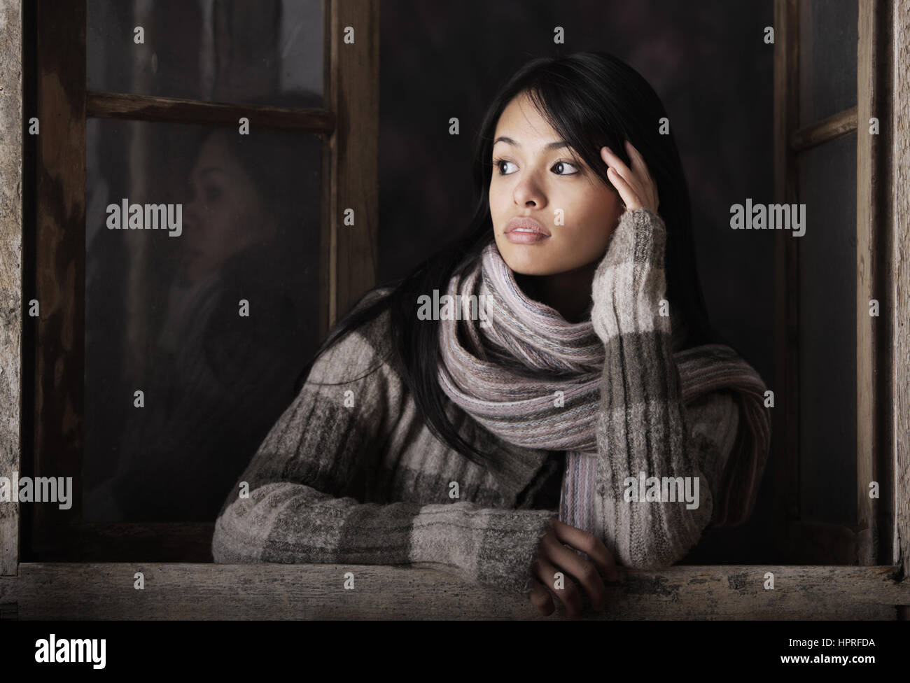 Portrait of a beautiful woman at window Stock Photo - Alamy