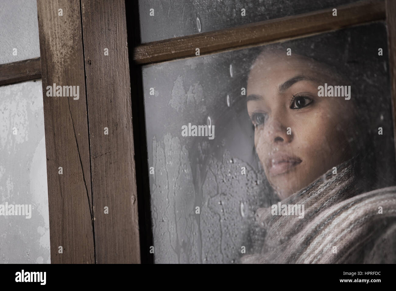 Portrait of a beautiful girl behind window Stock Photo - Alamy