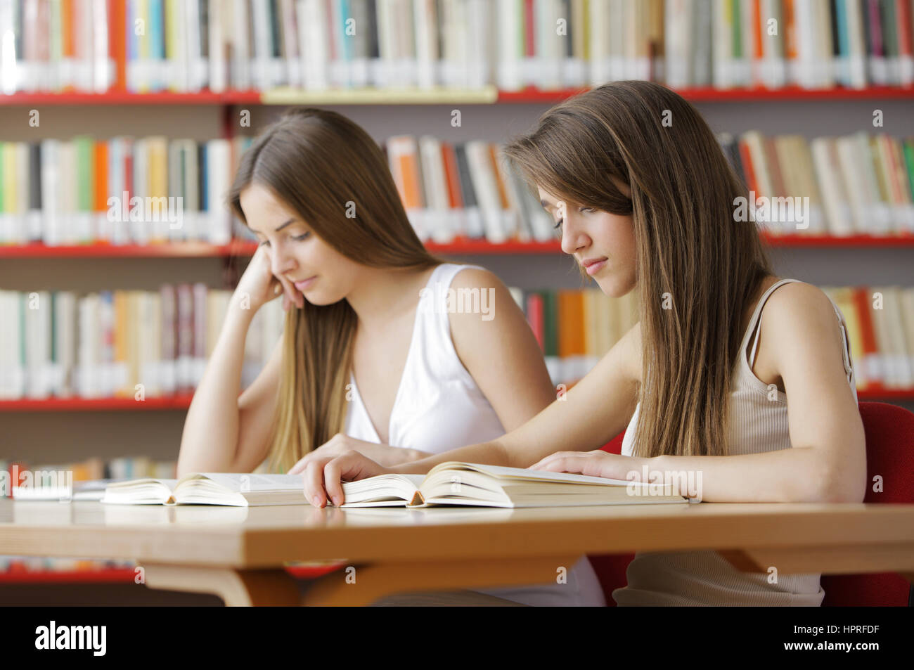 Candid capture of a pair of university students in the college library ...