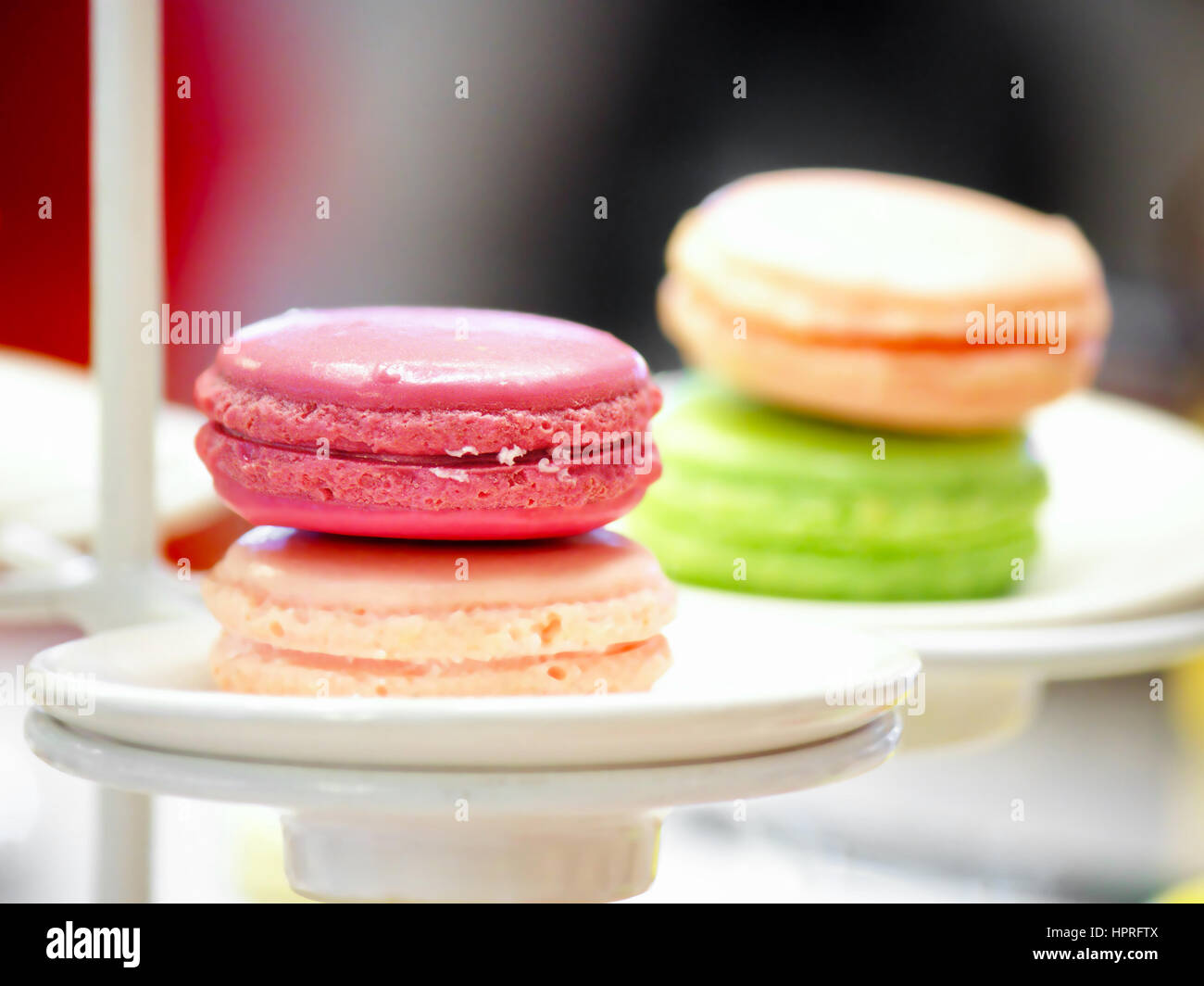 Colorful Assorted Macaroons on Small White Plate Stock Photo - Alamy