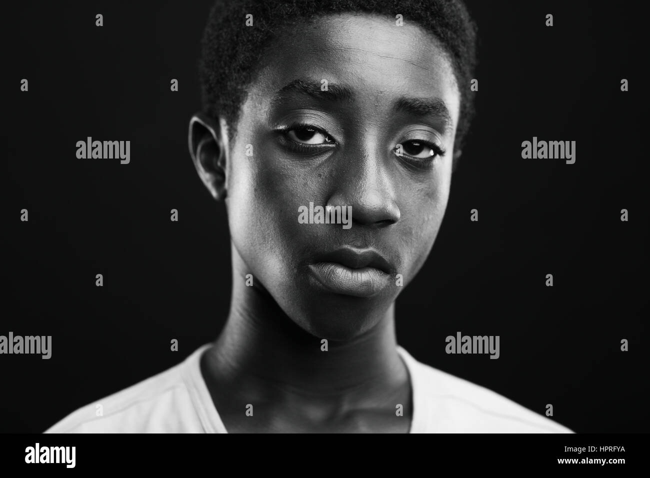 Portrait of an African boy on balck background Stock Photo - Alamy