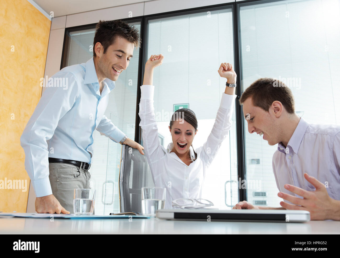 An excited young business team celebrating their success Stock Photo ...