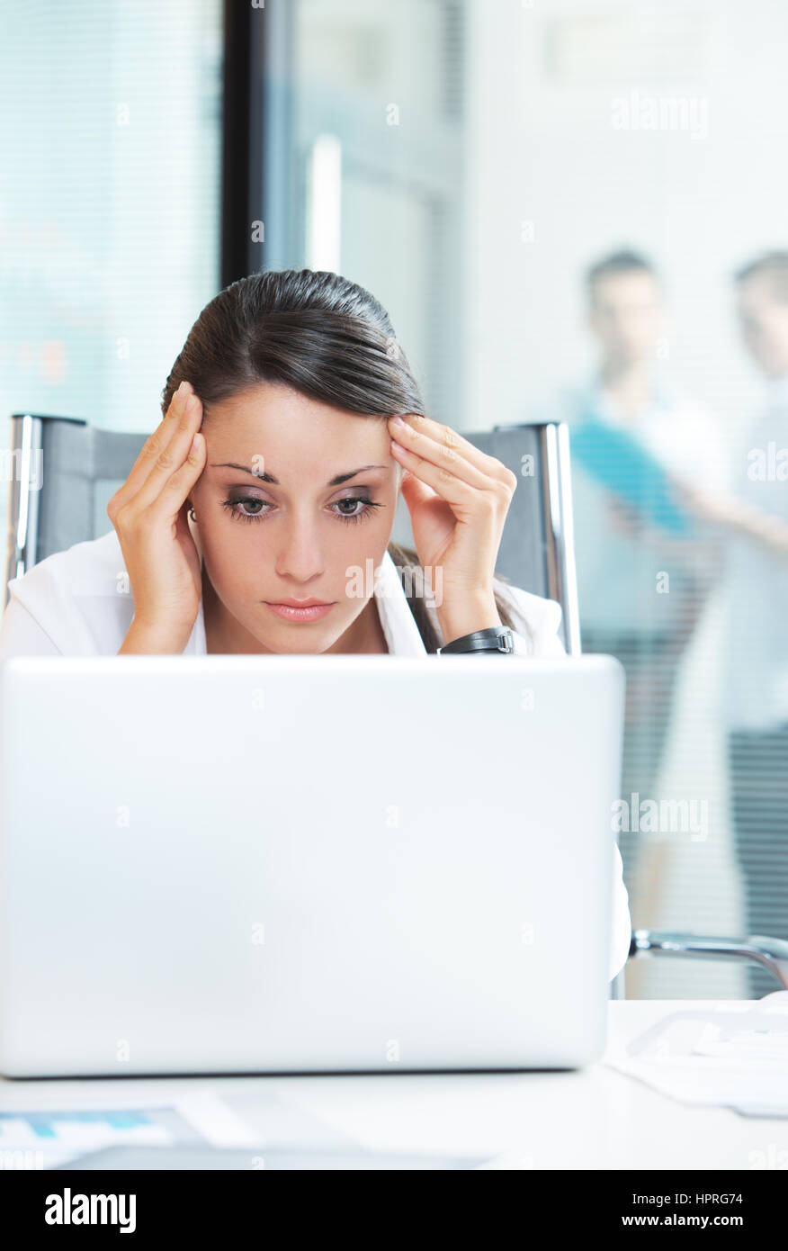 Young Businesswoman unhappy at work, she is think about her problems ...