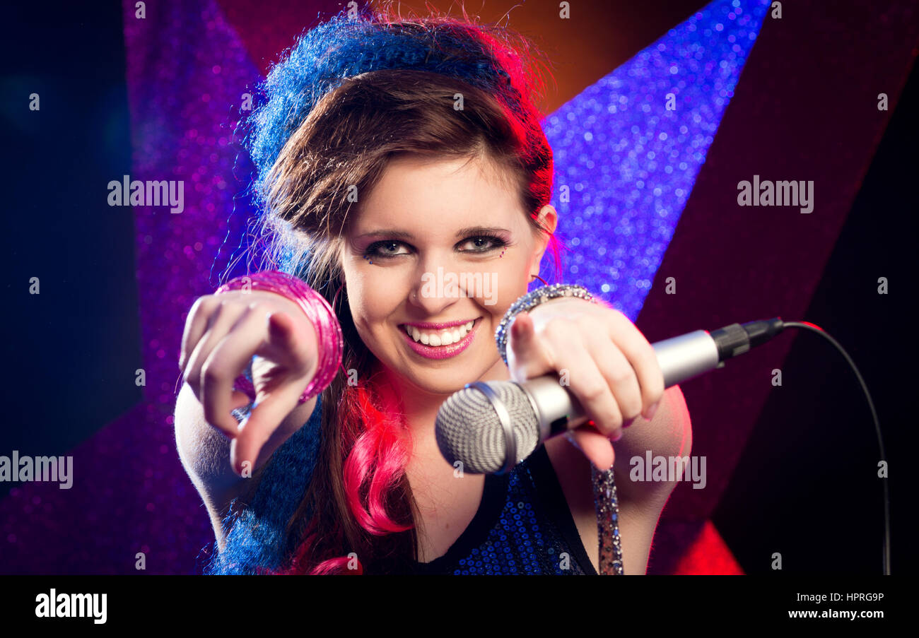 Young attractive singer on stage smiling at camera Stock Photo - Alamy