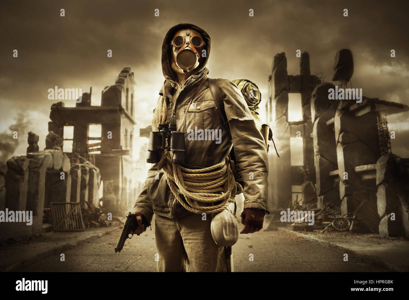 Post apocalyptic survivor in gas mask, destroyed city in the background ...