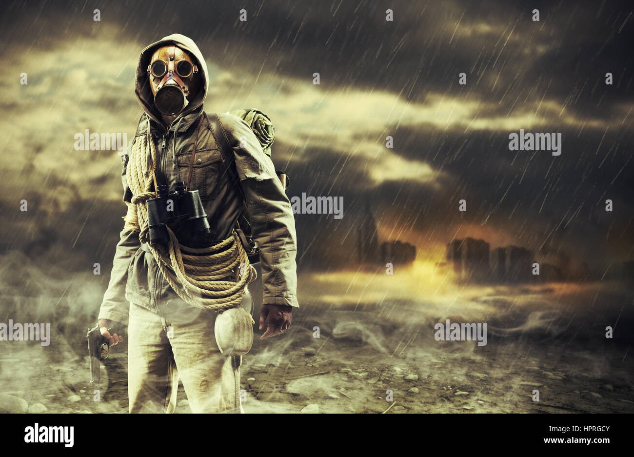A lonely hero wearing gas mask, city destroyed on the background Stock ...