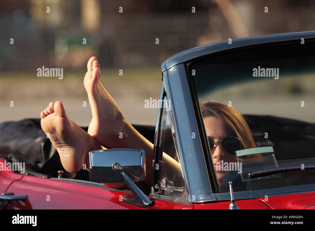 Woman legs out car window hi-res stock photography and images - Alamy
