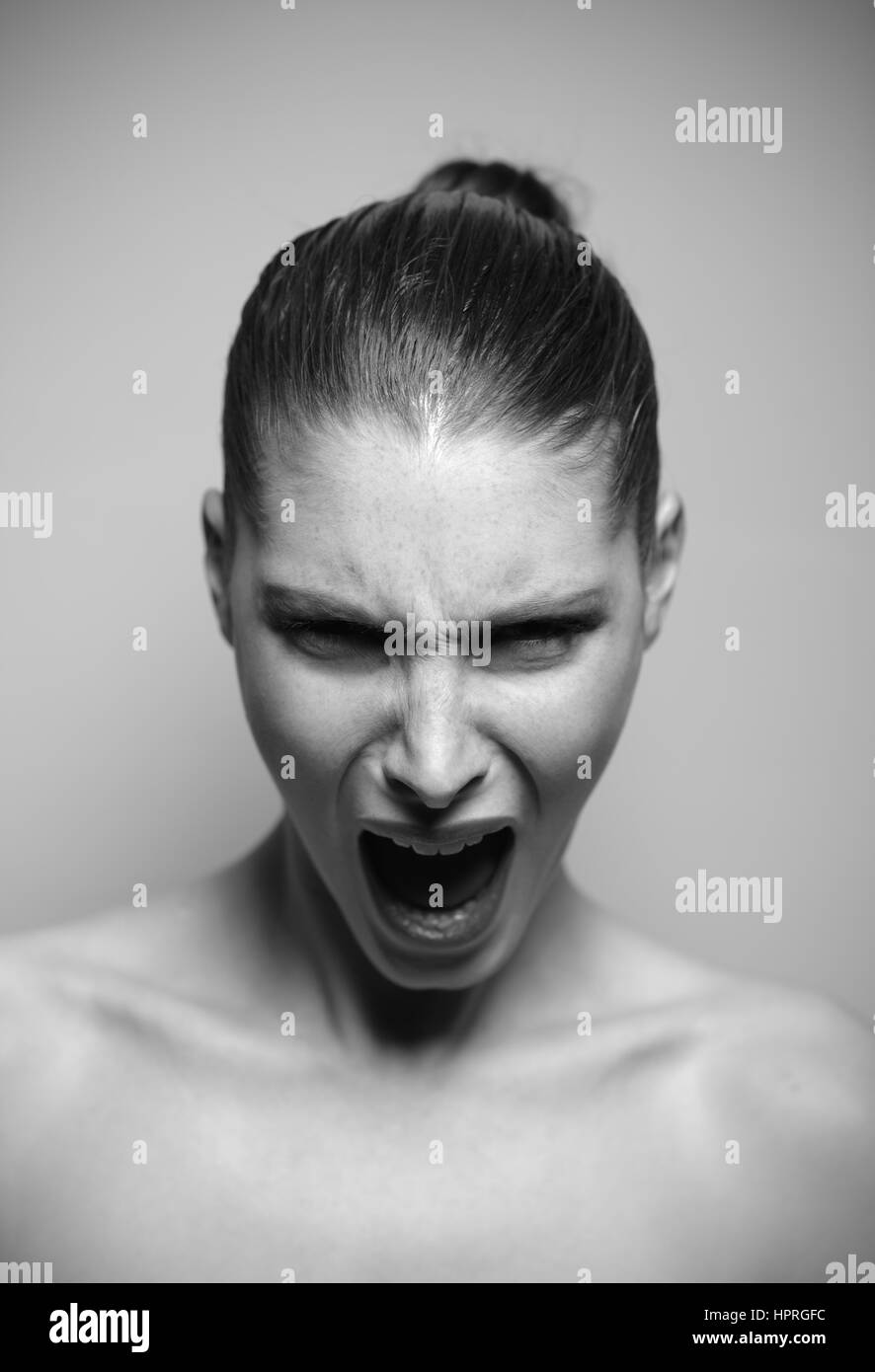 Beautiful woman shouting angry, shallow deep of field Stock Photo - Alamy