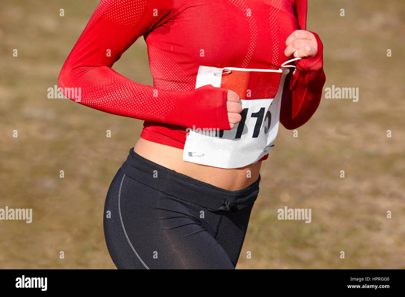 Female athletic runner with sweat. Cross country race. Outdoor circuit ...