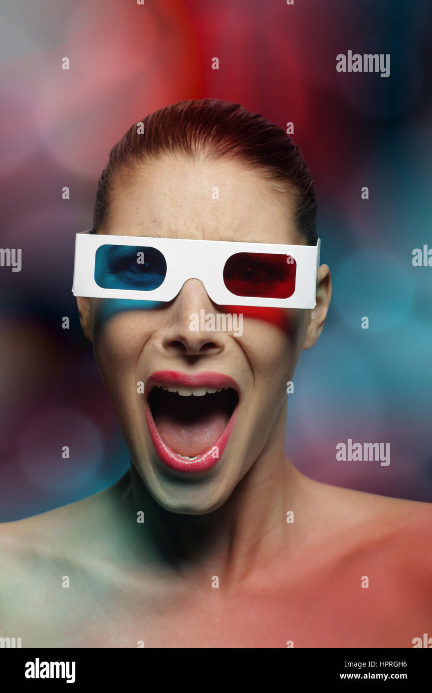 Scared woman watching a horror 3d movie Stock Photo - Alamy