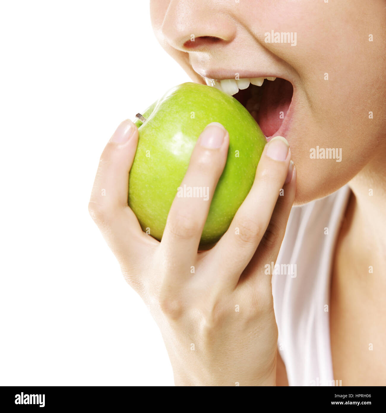 Beautiful young woman eating green apple. Isolated on white Stock Photo ...