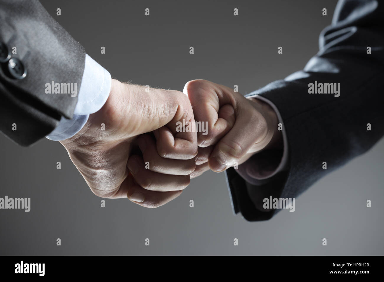 Business teamwork: two fists touching hand gesture Stock Photo - Alamy