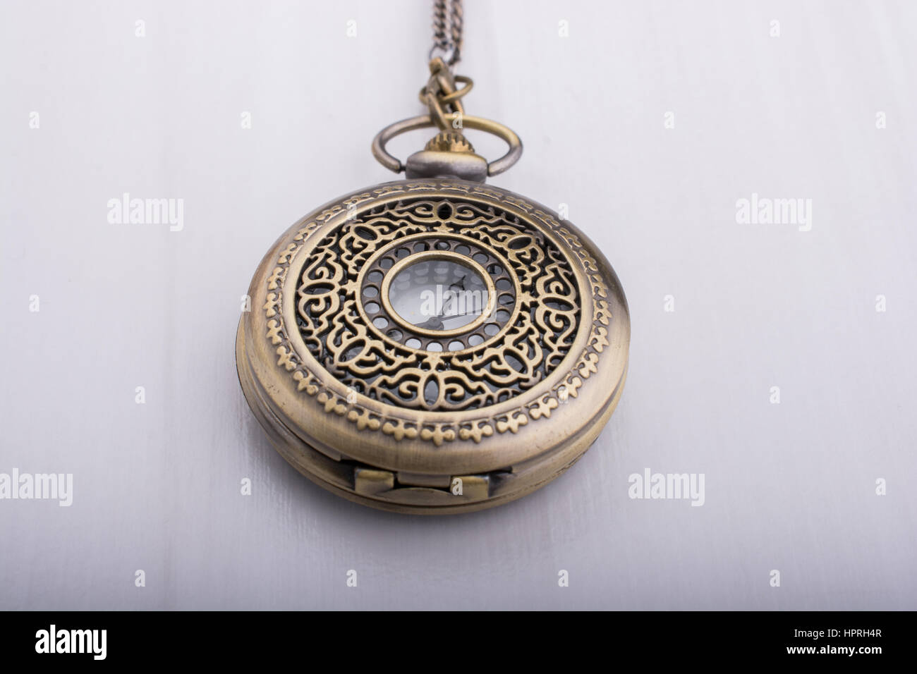 Retro style pocket watch on white background Stock Photo - Alamy